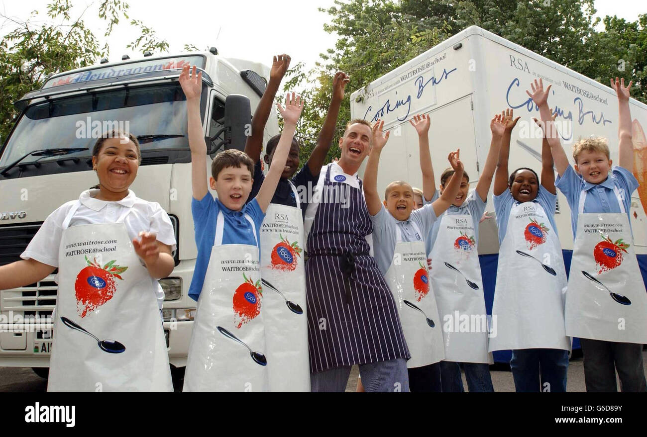 Celebrity chef Gary Rhodes (centre) is joined by pupils from St Peter's ...