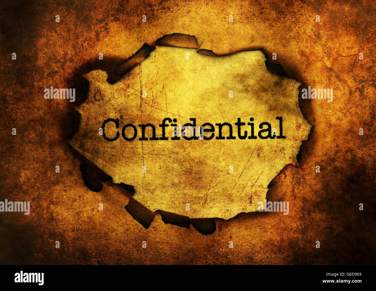 Confidential text on paper hole Stock Photo - Alamy