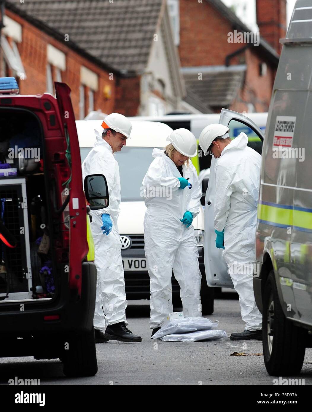 Forensic officers scene house fire wood hill hi-res stock photography ...