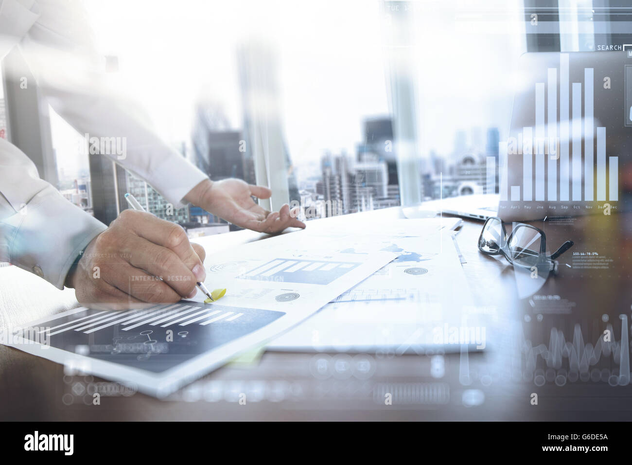 business documents on office table with smart phone and digital tablet ...