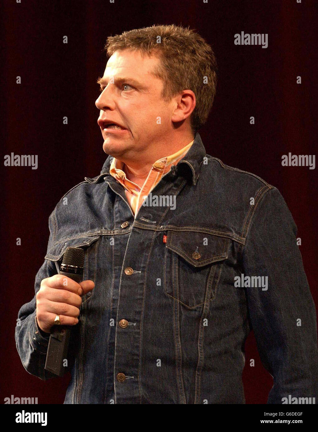 Celebrity music on stage 1 2 half length pulling face hi-res stock ...