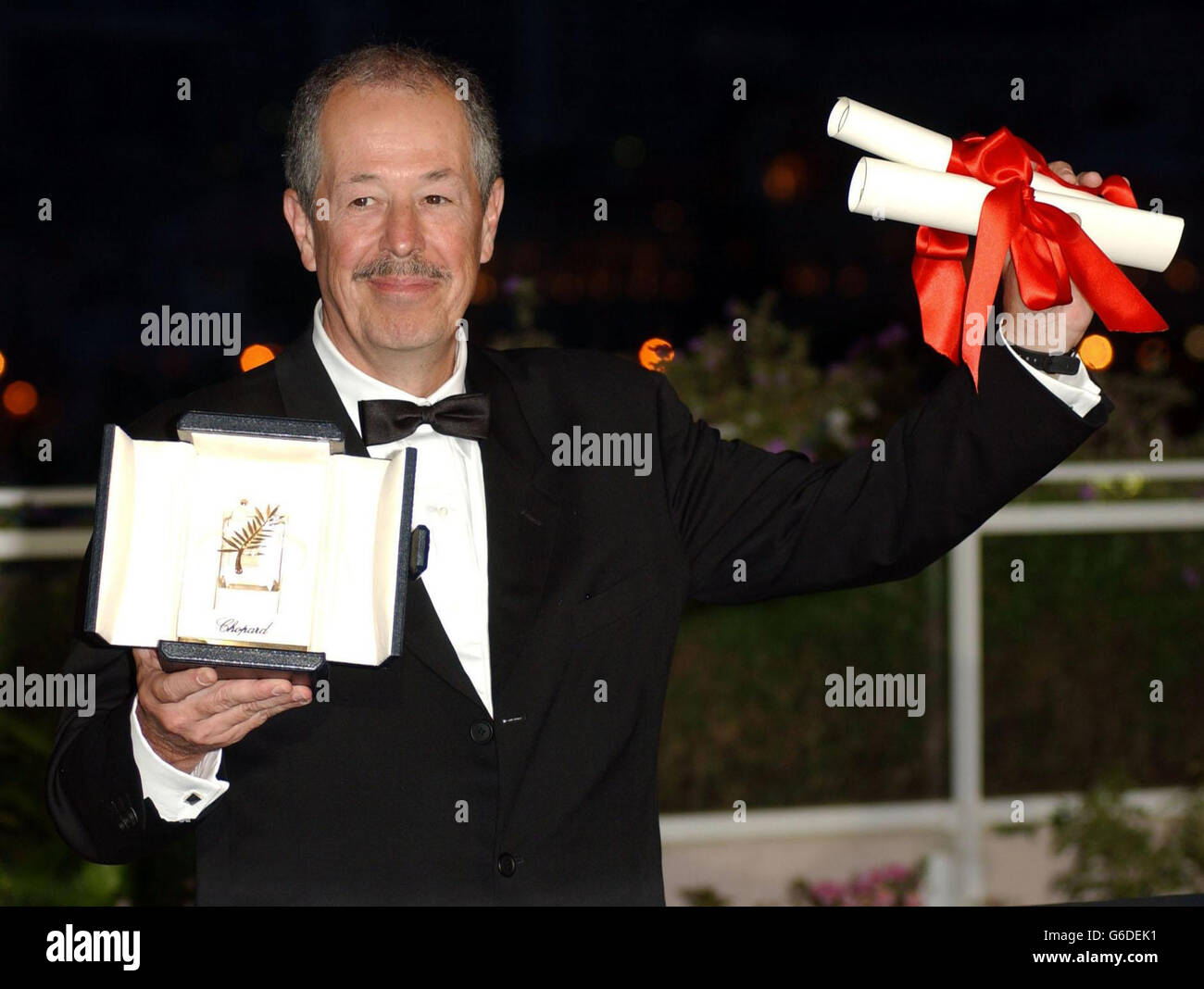 Canadian film director Denys Arcand with the best screenplay award for ...