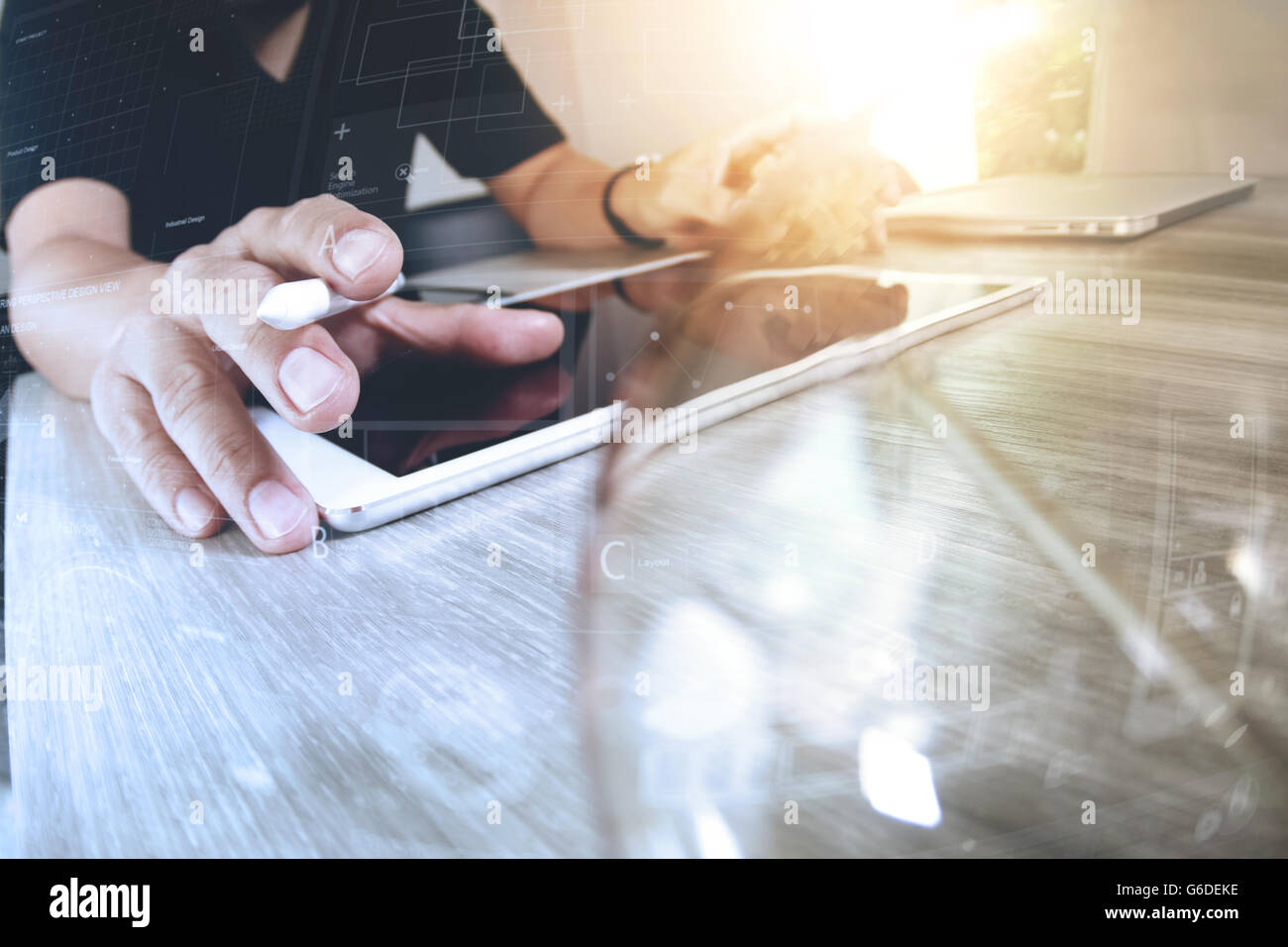 light bulb with designer hand working with laptop computer and creative ...