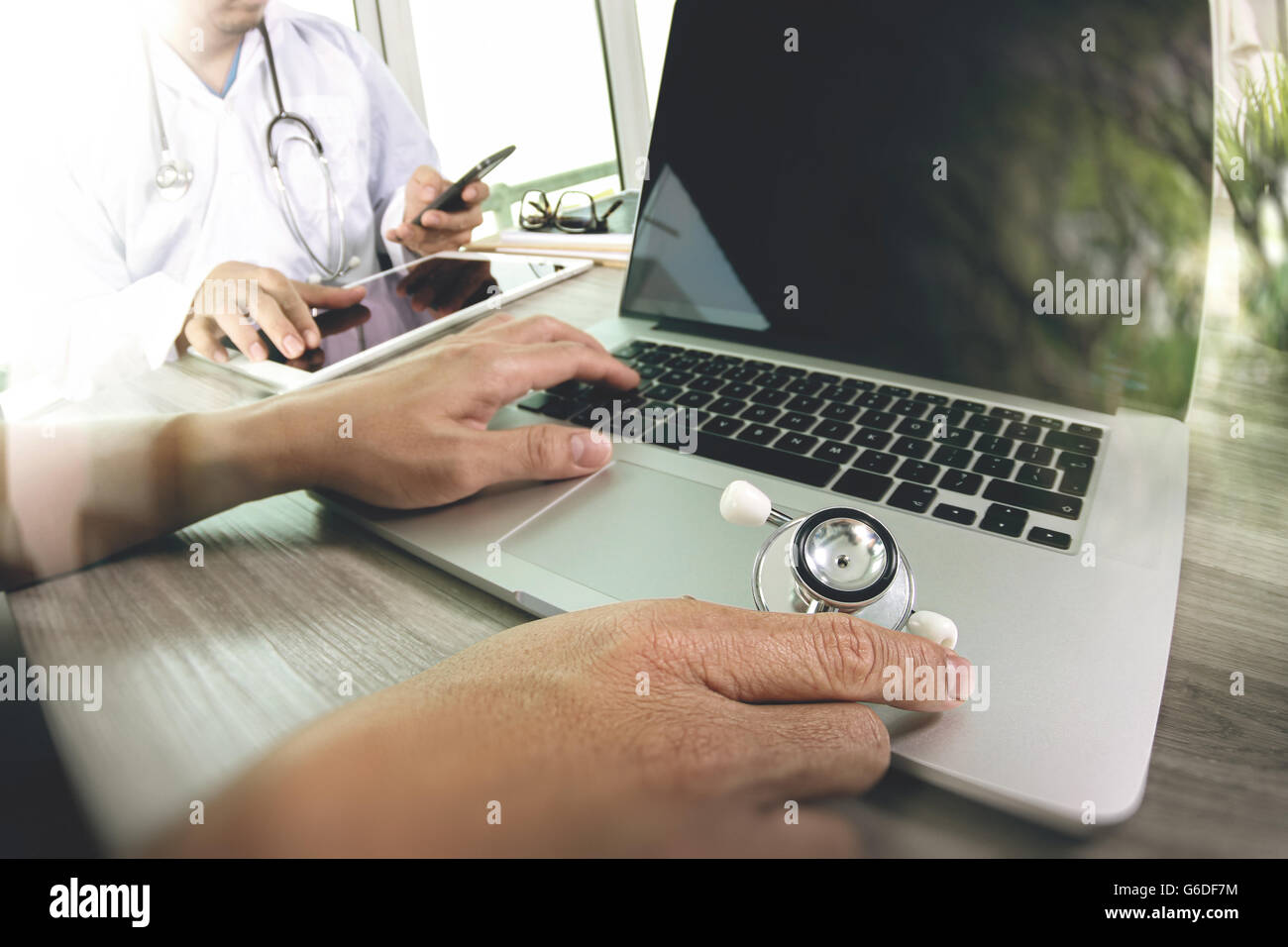 Medicine doctor hand working with modern computer and digital pro ...