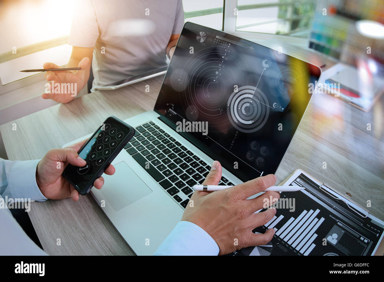 business documents on office table with smart phone and laptop computer ...