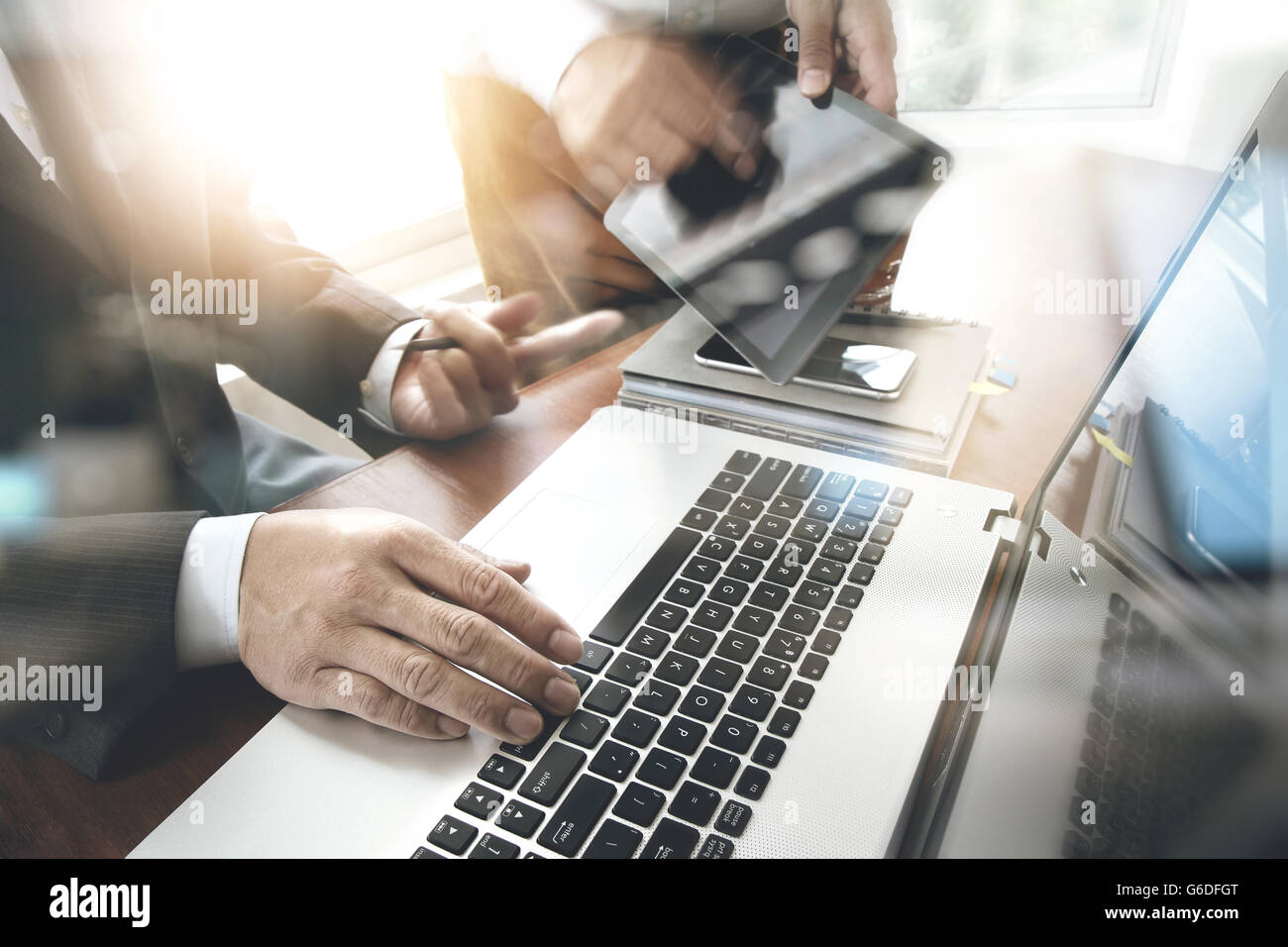 business documents on office table with smart phone and laptop computer ...