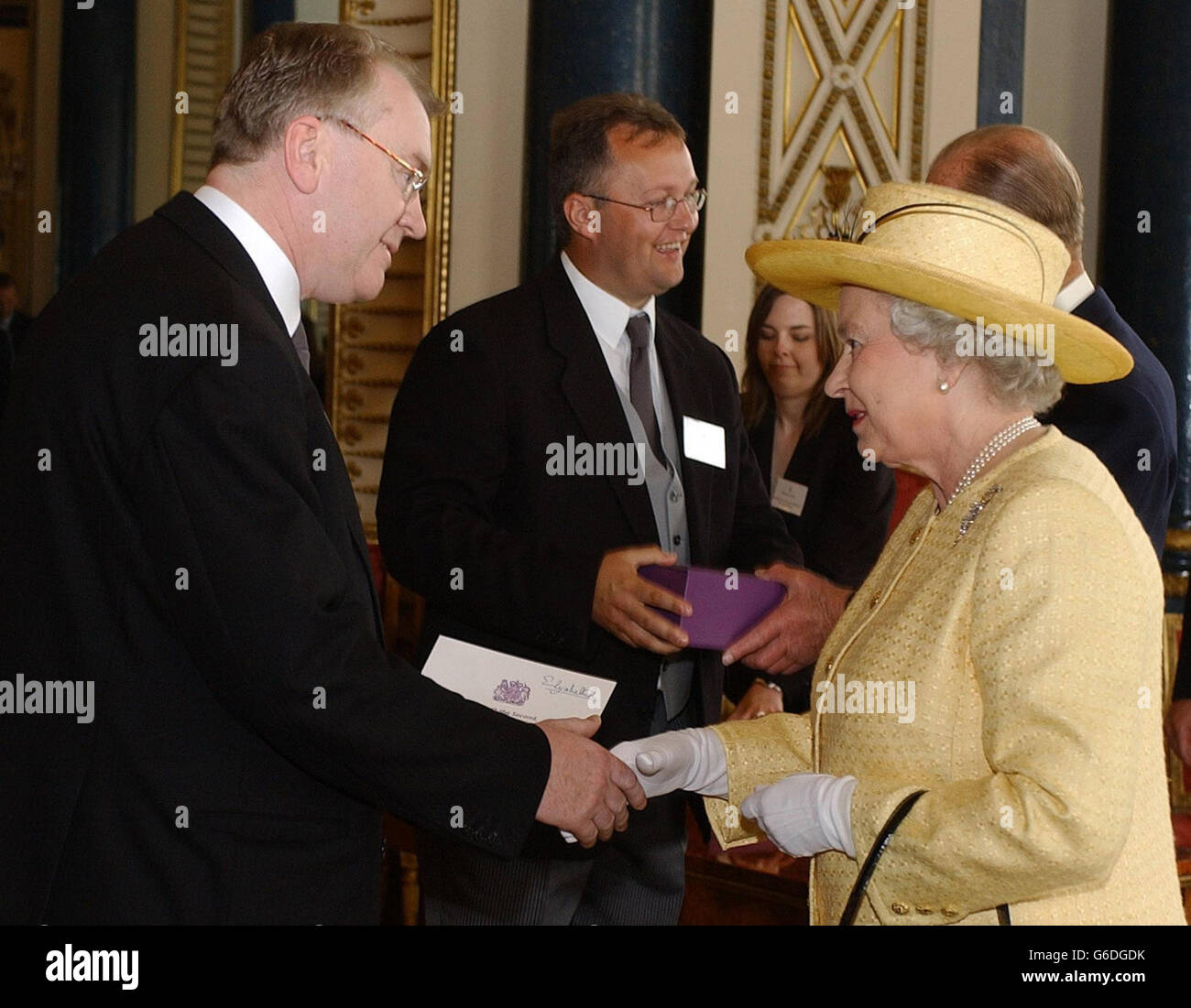 Queen Elizabeth II (right) presents a Golden Jubilee Award for ...