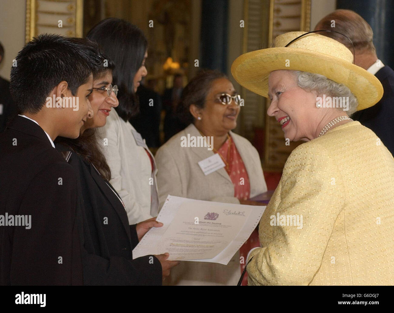 Queen Elizabeth II (right) presents a Golden Jubilee Award for ...