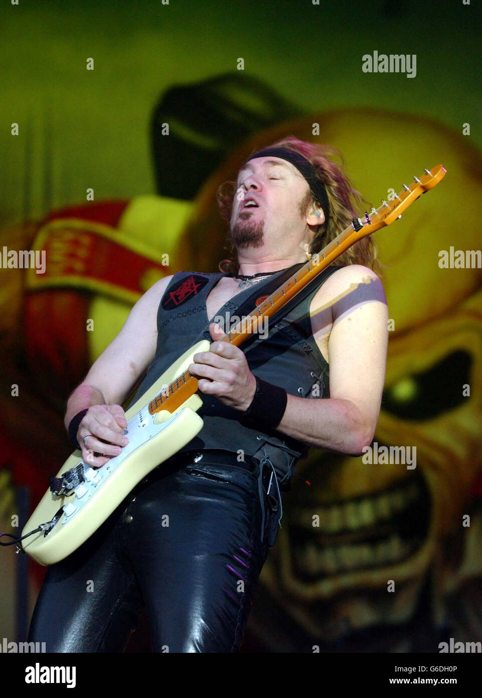 Iron Maiden's Adrian Smith performing on stage at the Download Festival ...