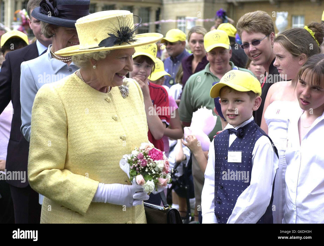 The Queen talks to children attending the coronation party at ...