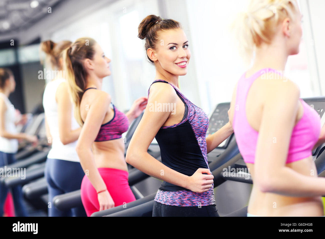Group of fit women working out on treadmill in gym Stock Photo - Alamy
