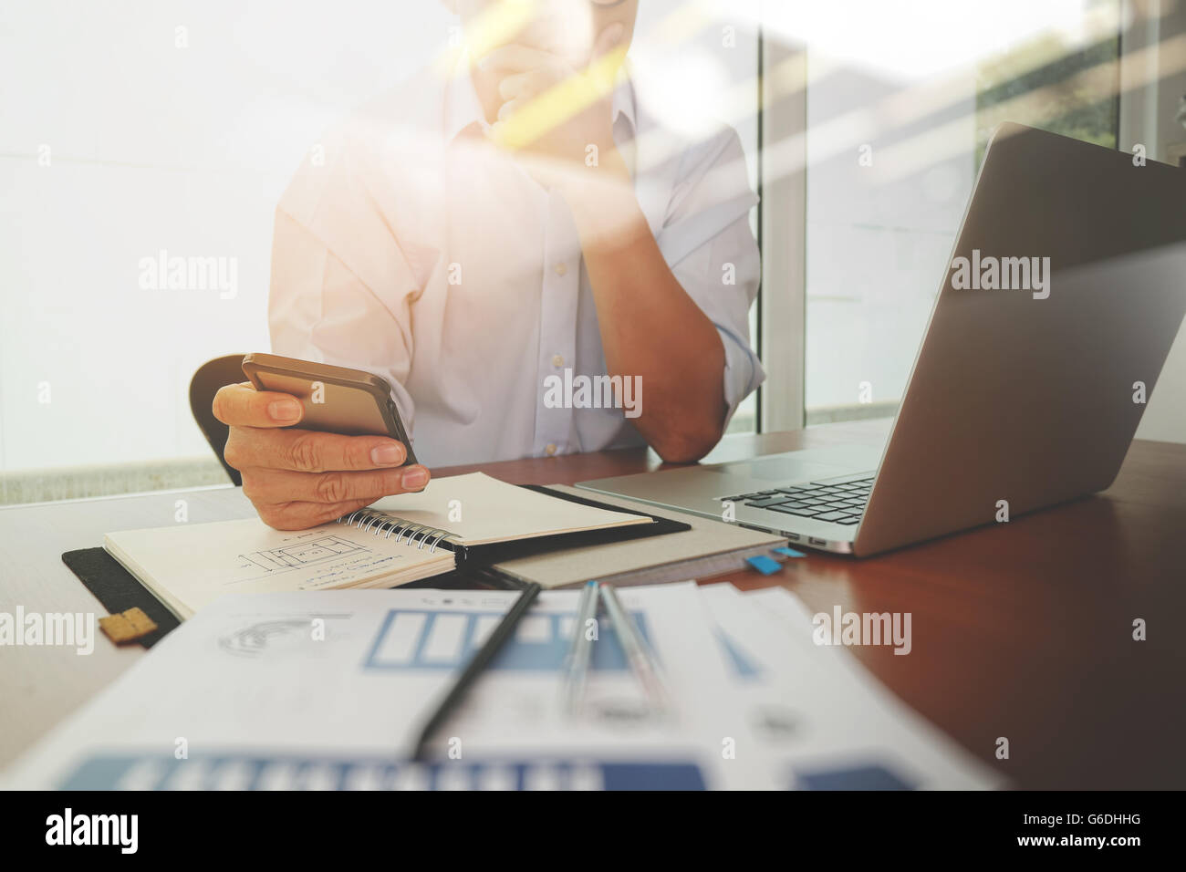 business documents on office table with smart phone and laptop computer ...