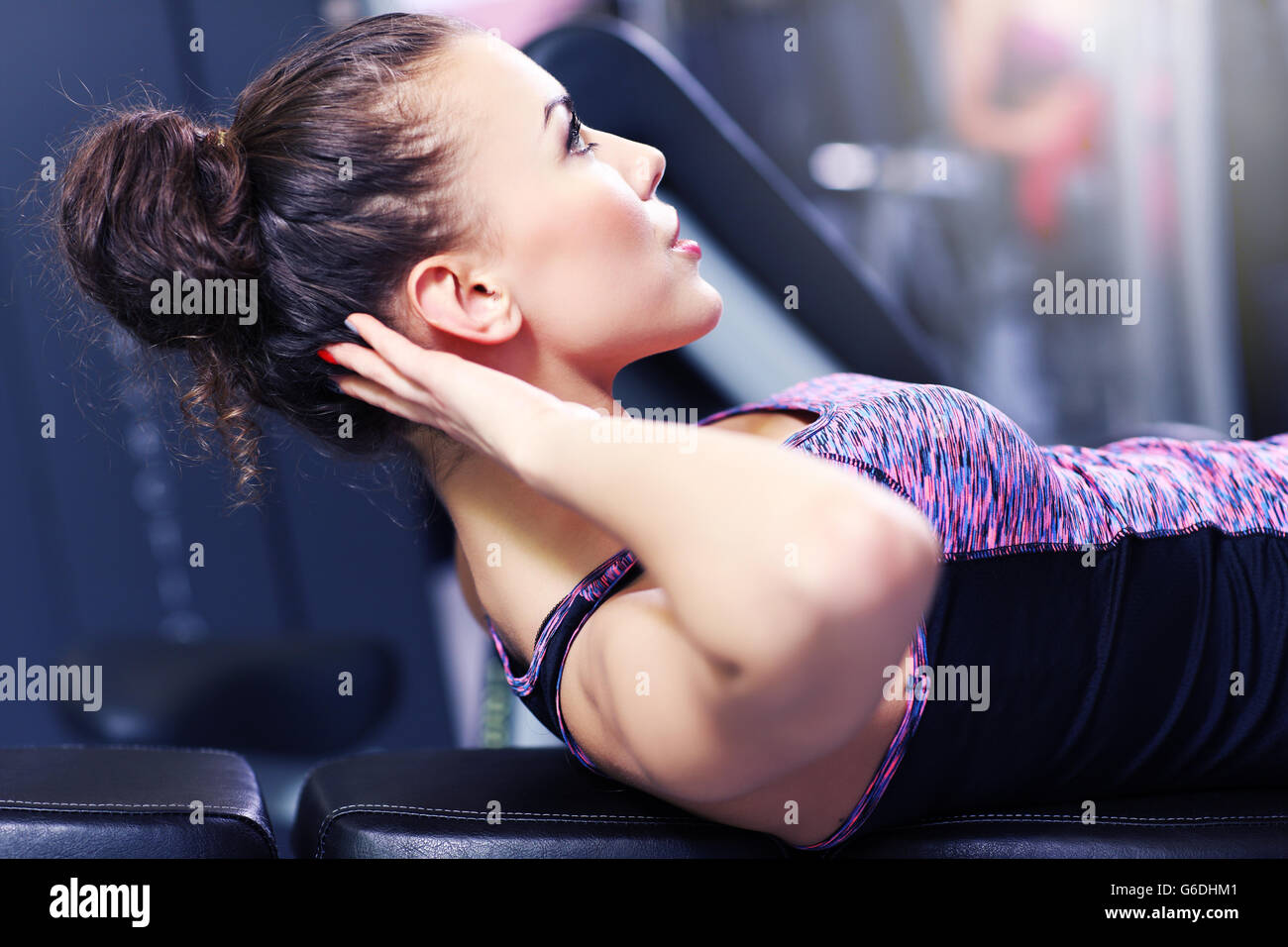 Picture of fit woman doing sit ups in gym Stock Photo - Alamy