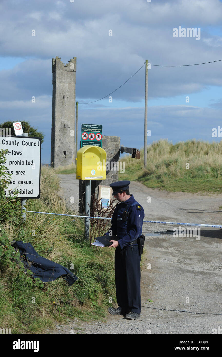 A Garda at the scene at Mornington Beach, near Drogheda, County Meath ...