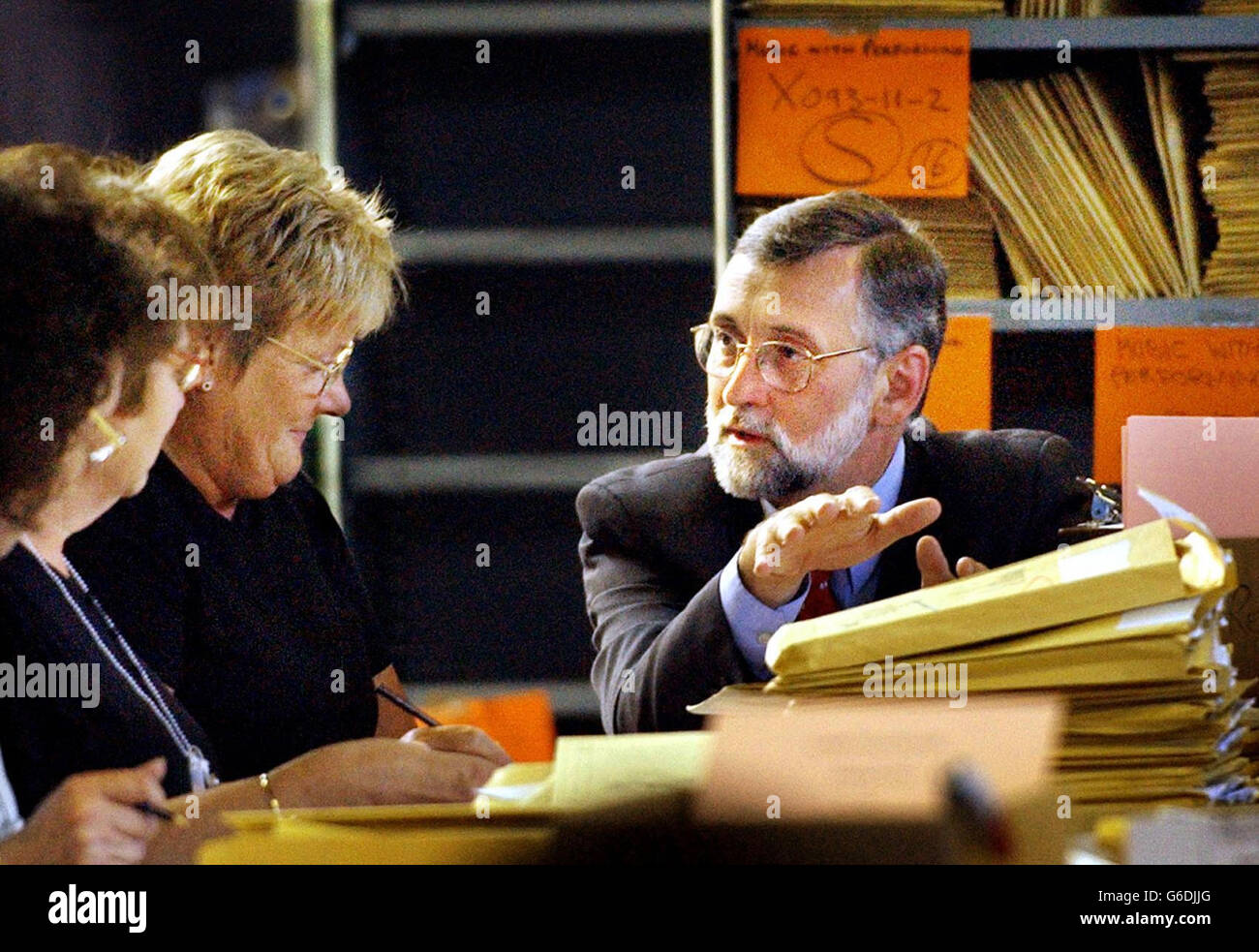 Scottish Education Minister Peter Peacock talks to exam markers at the ...