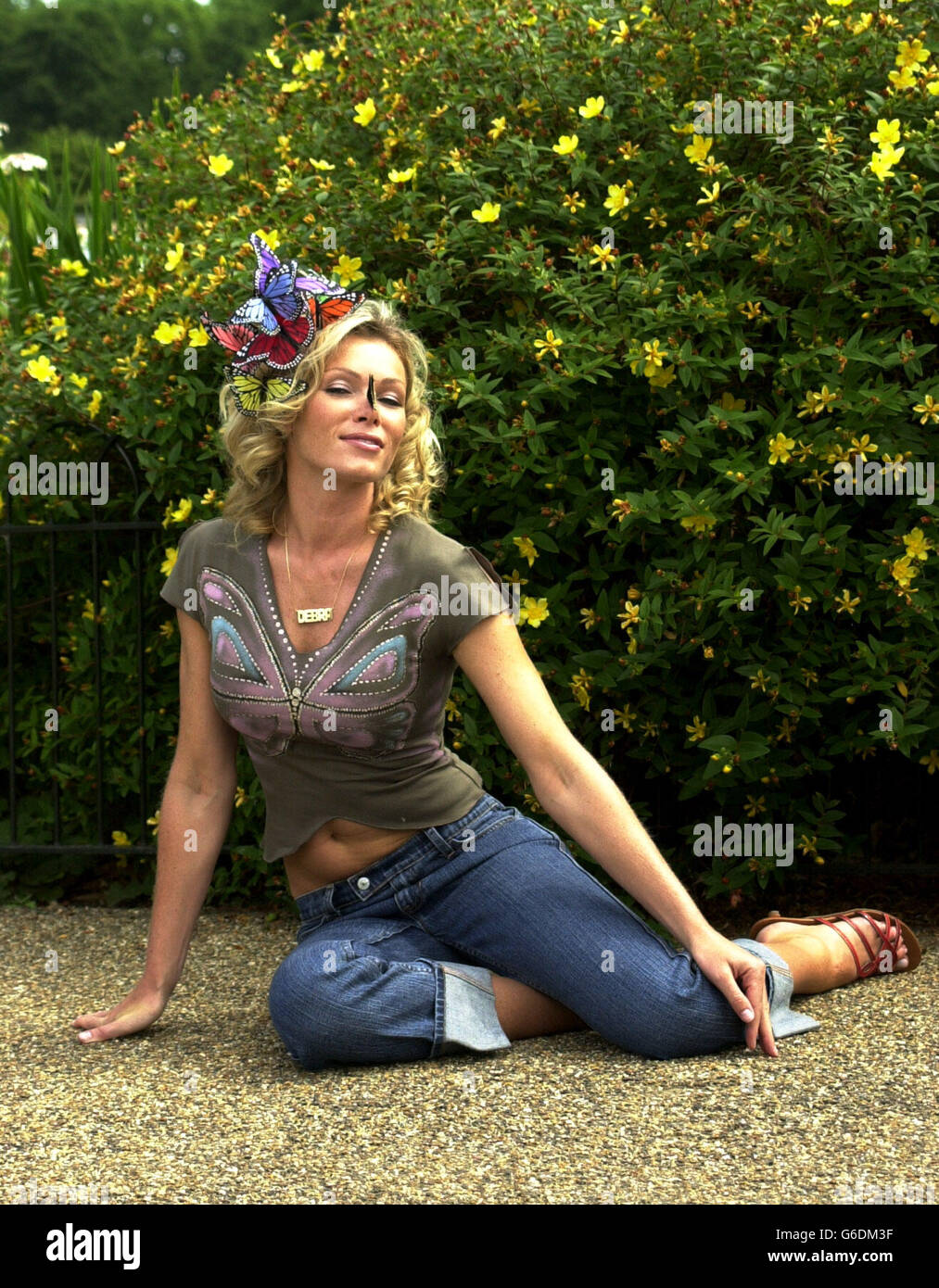 Nell McAndrew in London's Hyde Park with a butterfly on her nose to ...