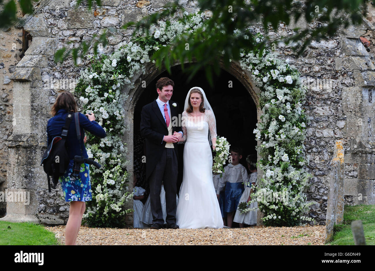 James Meade and Lady Laura Marsham after their wedding leave the Parish ...
