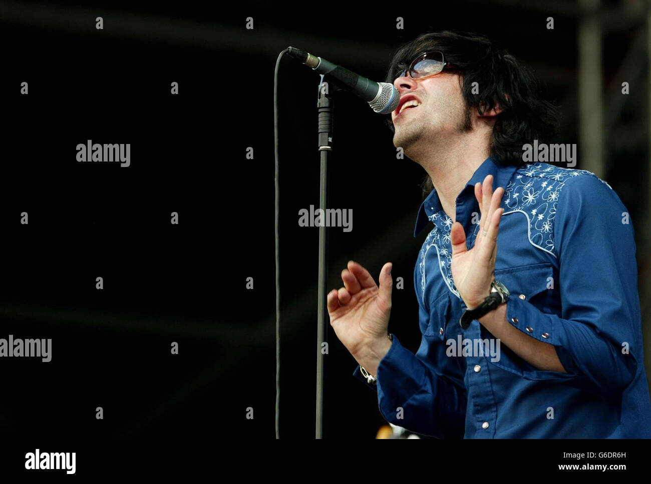 The Charlatans lead singer Tim Burgess performing on stage at T in the ...