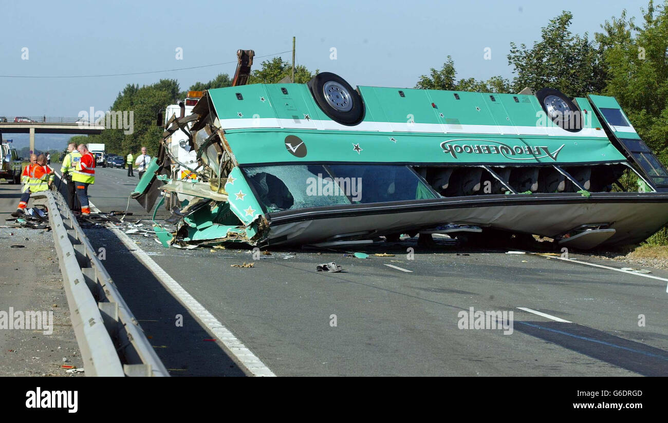 The wreckage of a coach is recovered after it was involved in accident ...