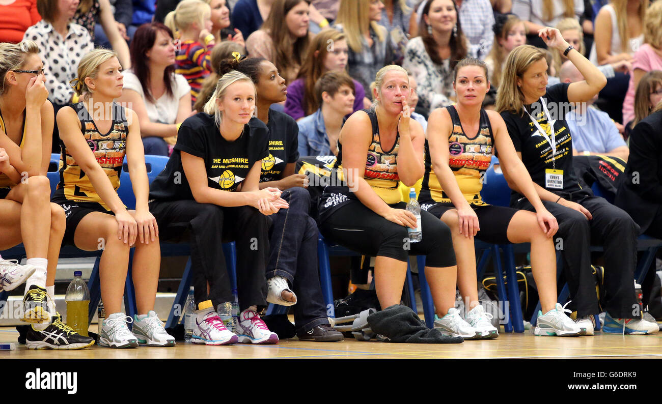 Some of the cast from Coronation Street sit on the bench during a ...