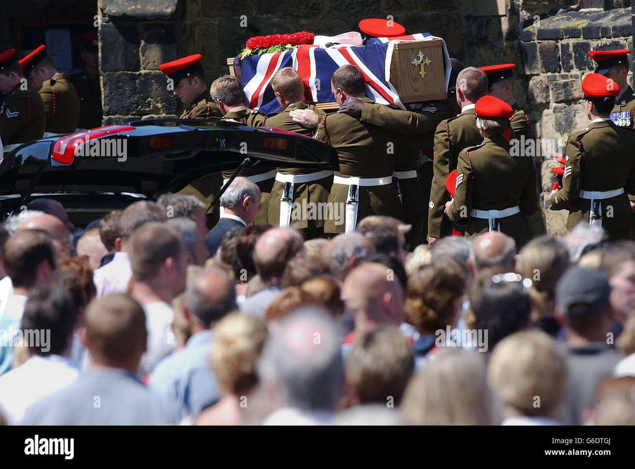 Soldiers carry the coffin of Lance Corporal Ben Hyde into All Saints ...
