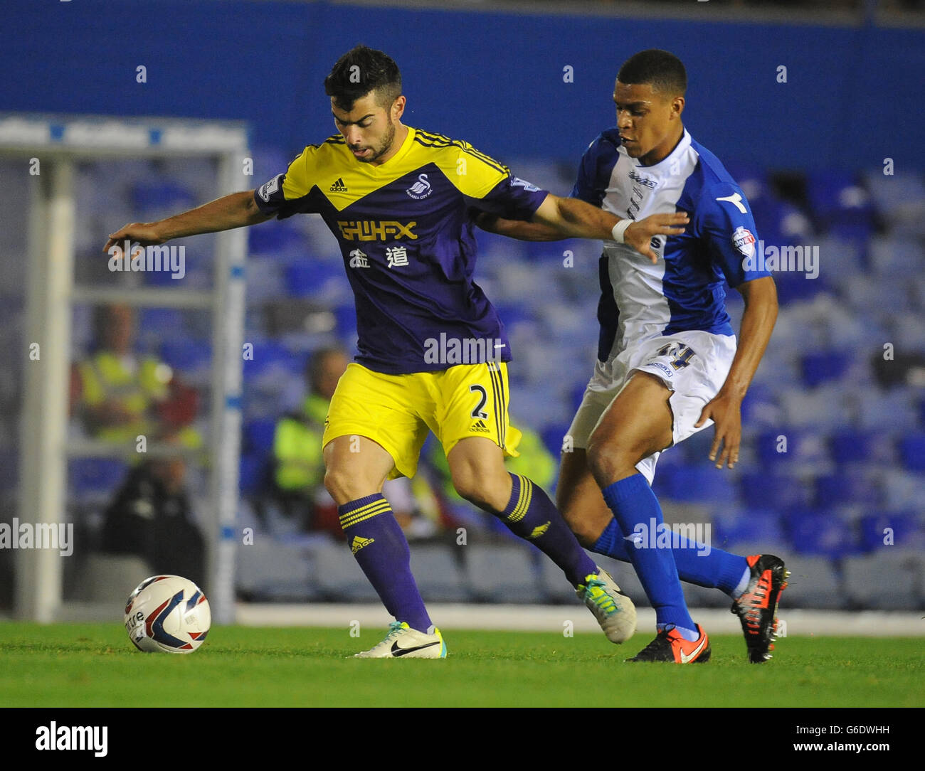 Swansea City's Jordi Amat (left) and Birmingham City's Tom Adeyemi ...