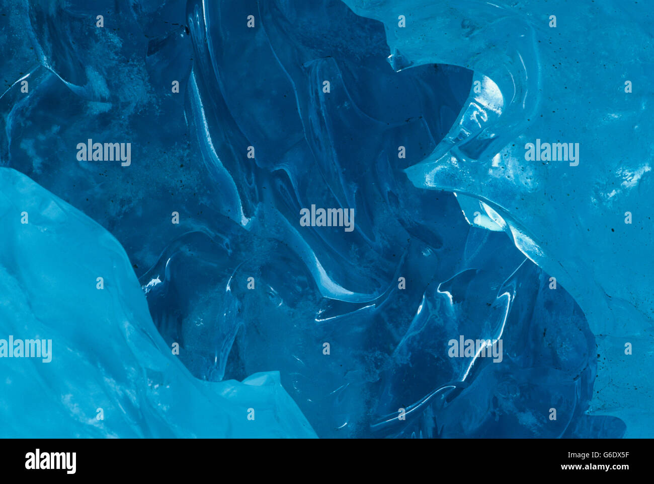 USA, Alaska, Kenai Fjords National Park, Melting water carves blue ice ...