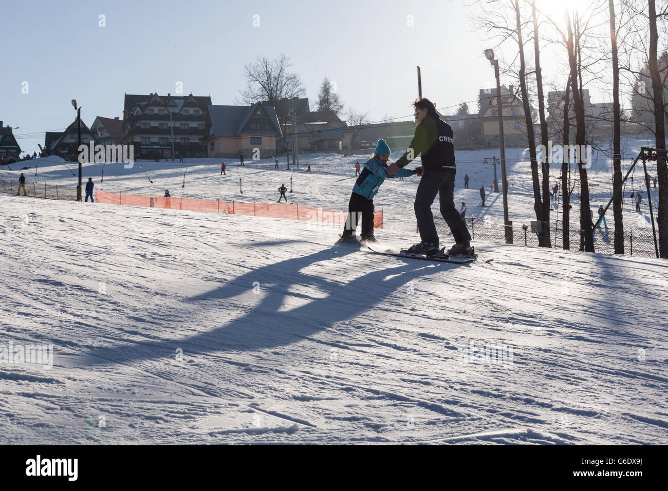 Skiing and sliding, winter time in Tatra Mountains Stock Photo - Alamy