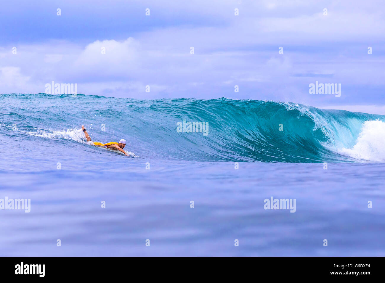 Surfer on a wave Stock Photo - Alamy