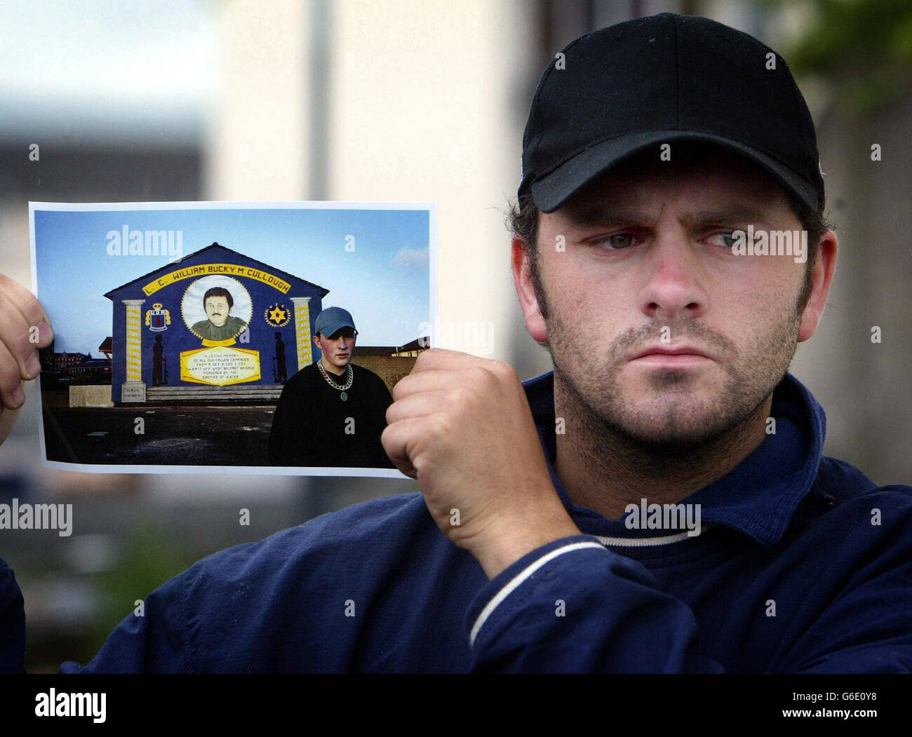 Kenny Mccullough holds up a picture of his brother Alan McCullough ...