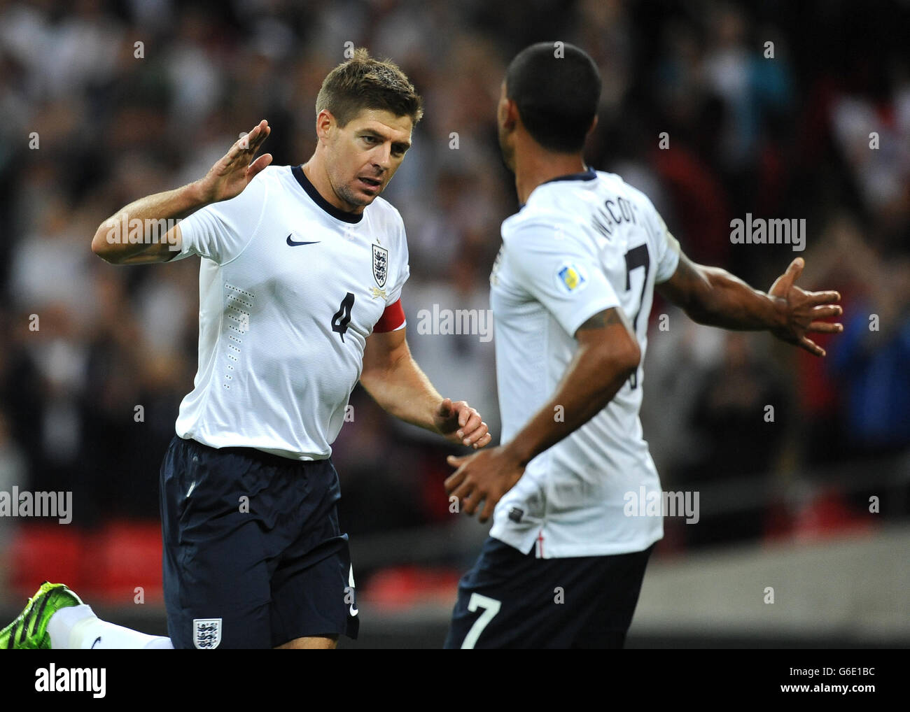 England's Steven Gerrard (left) celebrates with Theo Walcott after ...