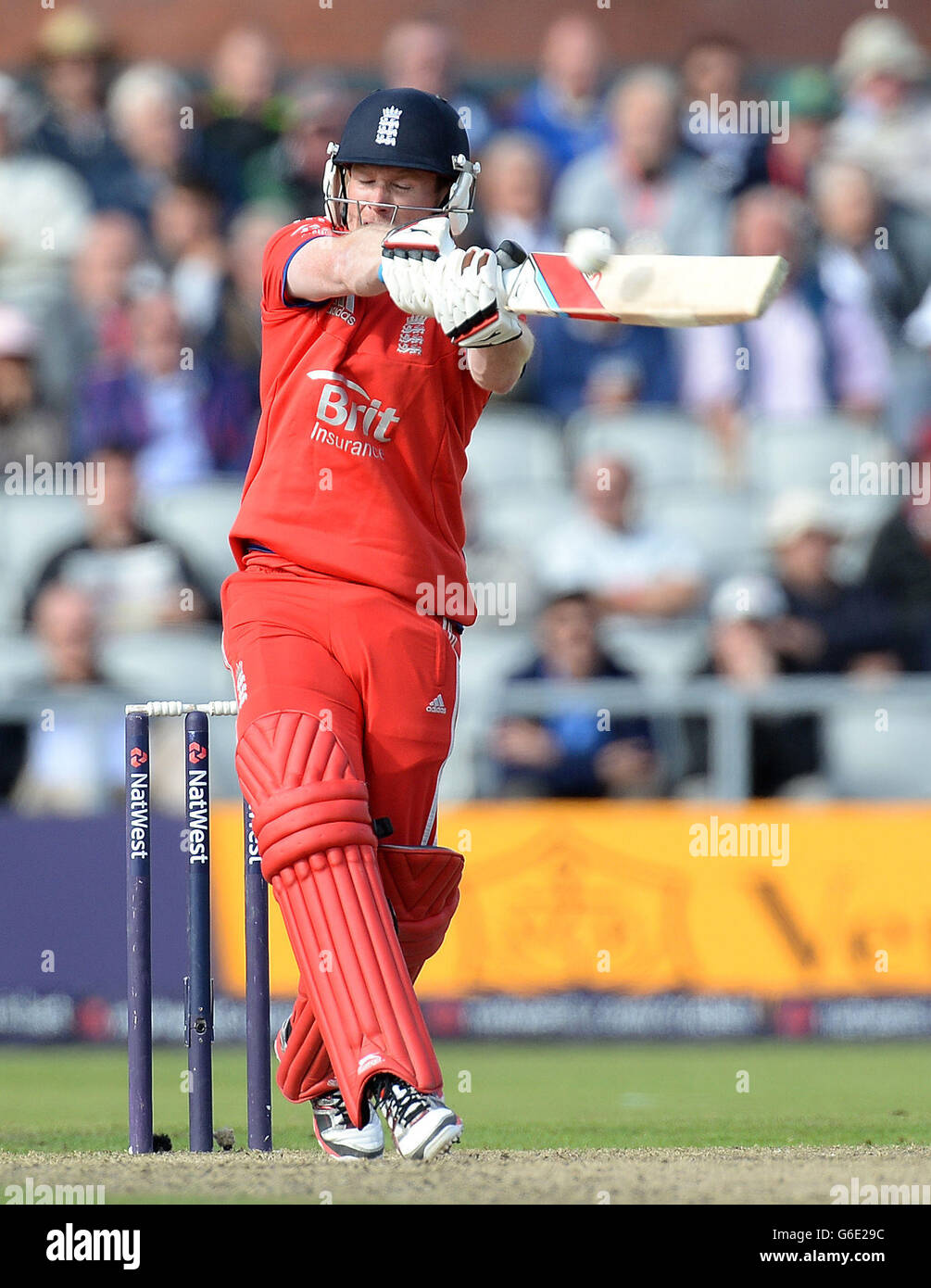 England's Eoin Morgan hits out from the bowling of Australia's Mitchell ...