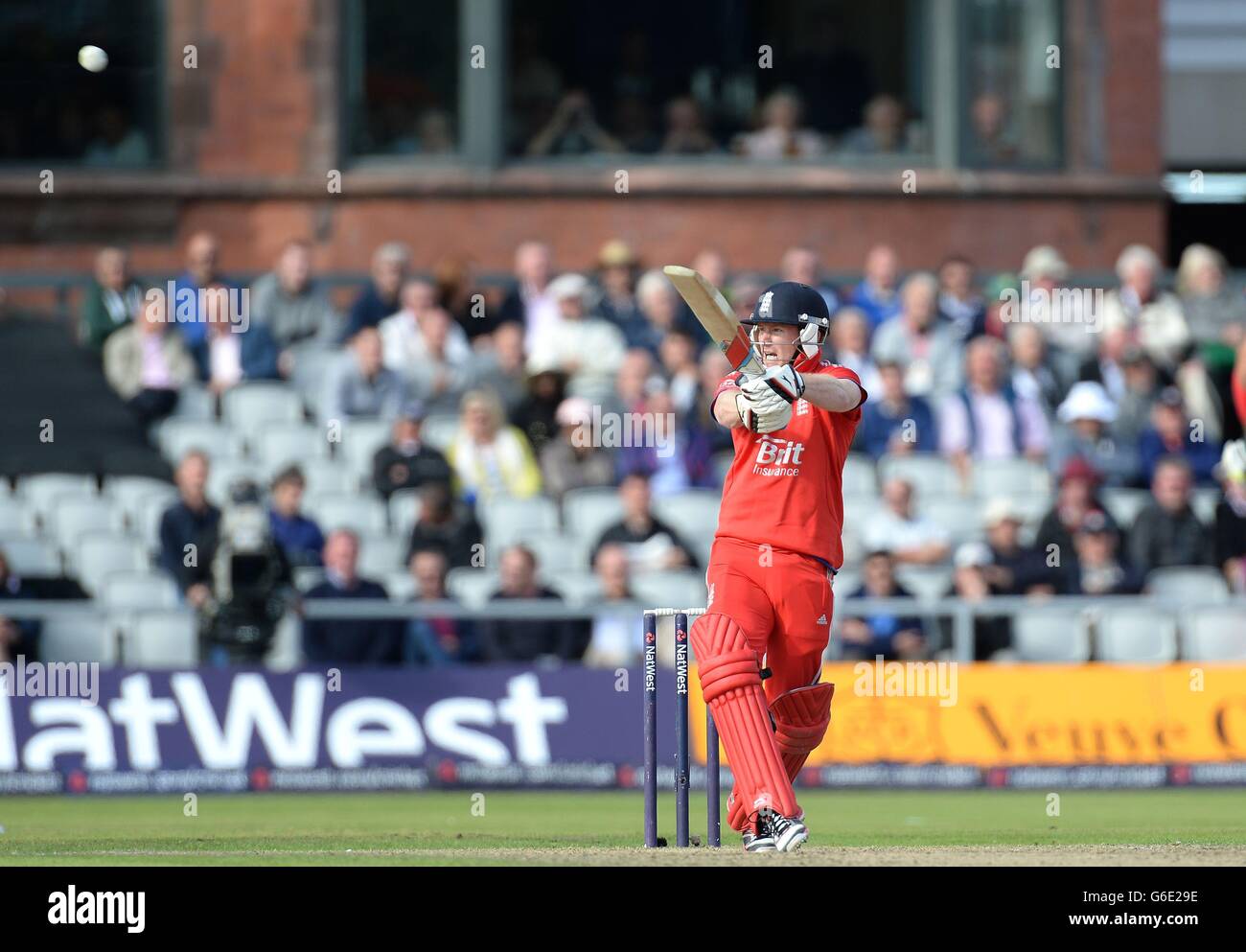 England's Eoin Morgan hits out from the bowling of Australia's Mitchell ...