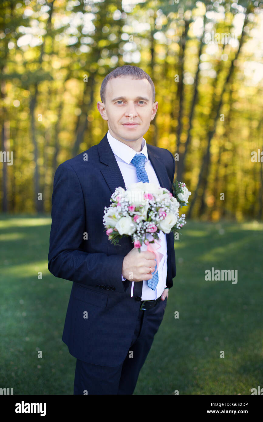 Stylish groom in suit Stock Photo - Alamy