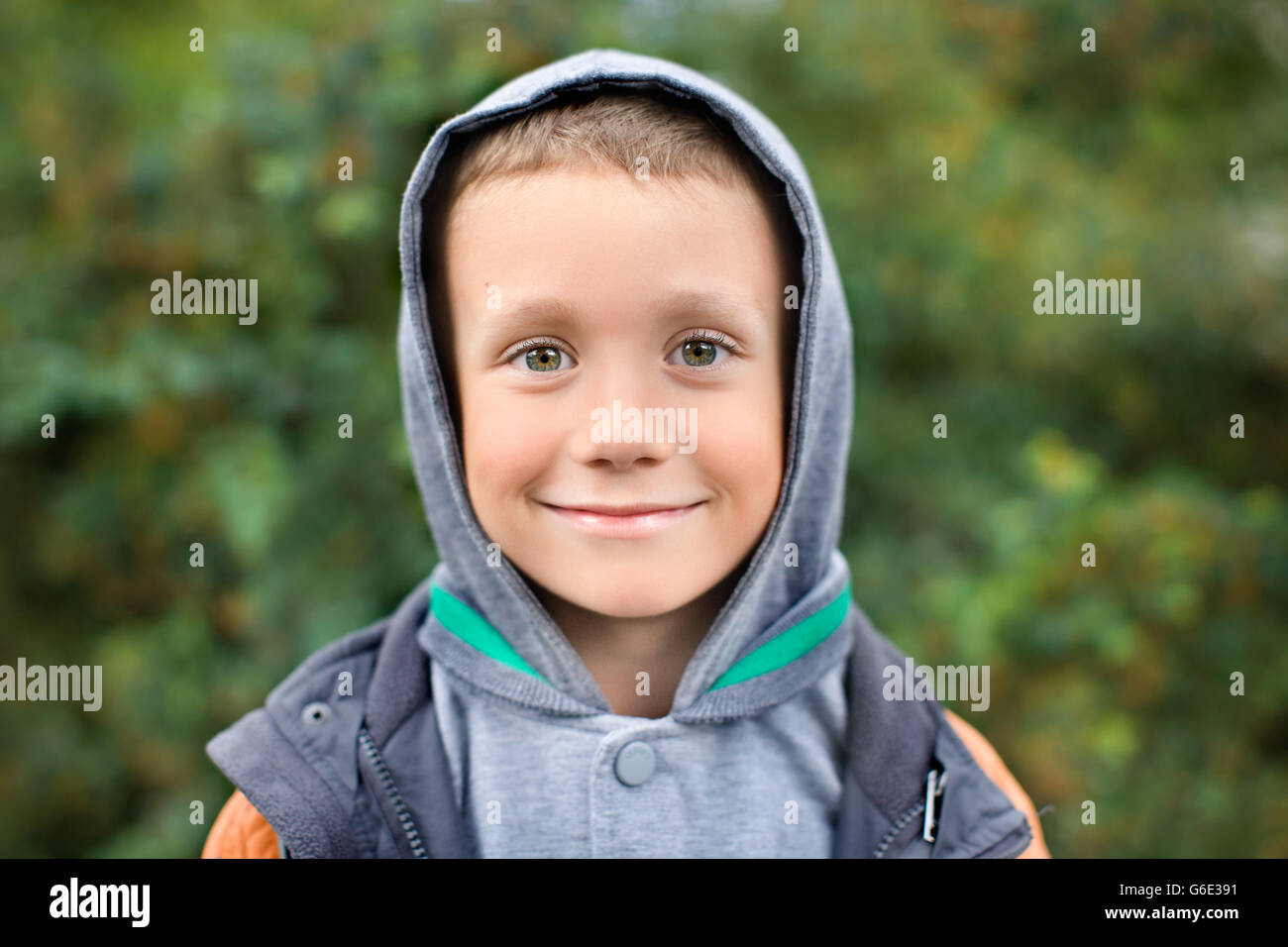 The boy looks at the camera Stock Photo - Alamy
