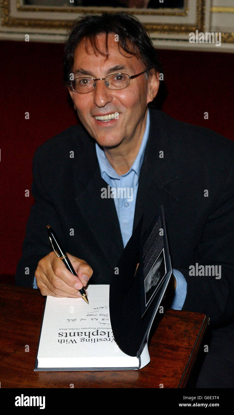 Lyricist don black poses photographers book launch wrestling elephants ...