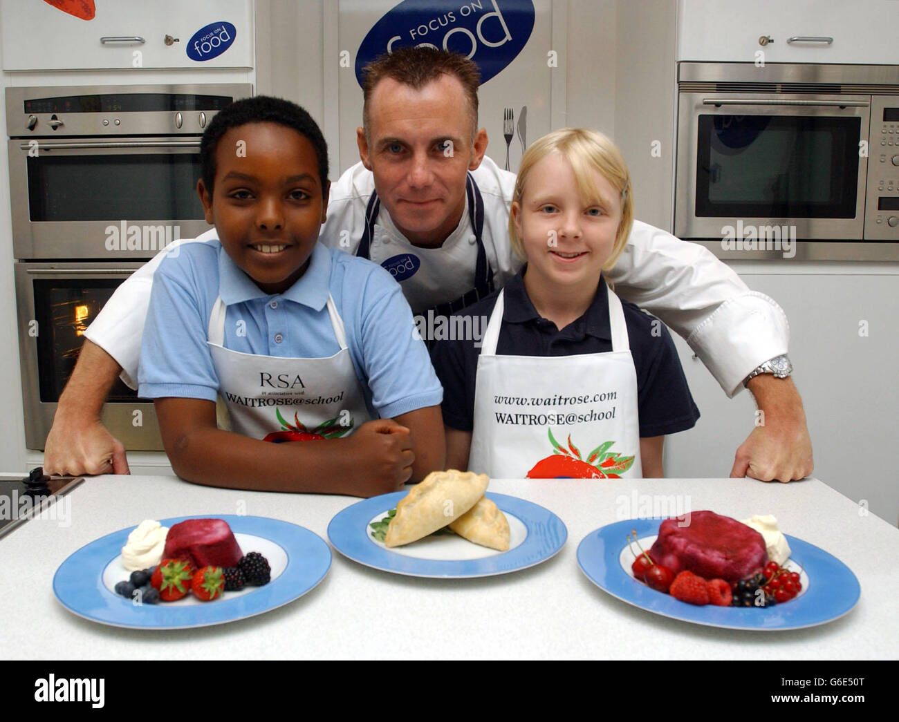 Celebrity chef Gary Rhodes gives a cooking masterclass to children from ...
