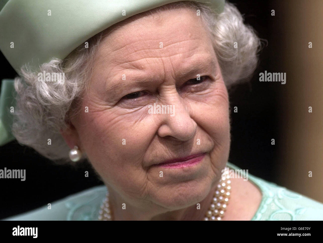 The Queen inspects a parade of cars that have been donated by various ...