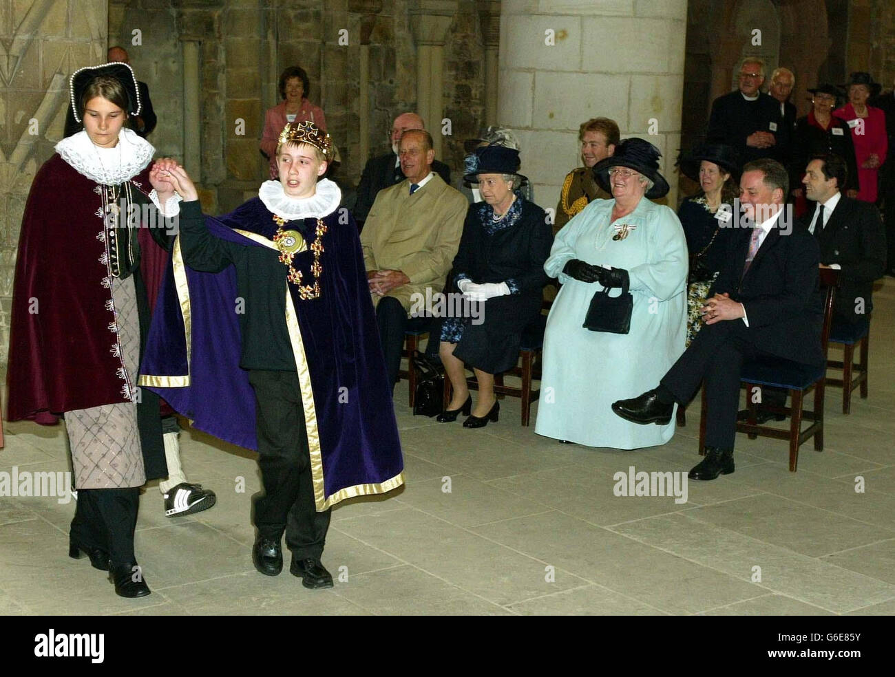 Britain's Queen Elizabeth II (centre) and the Duke of Edinburgh, watch ...