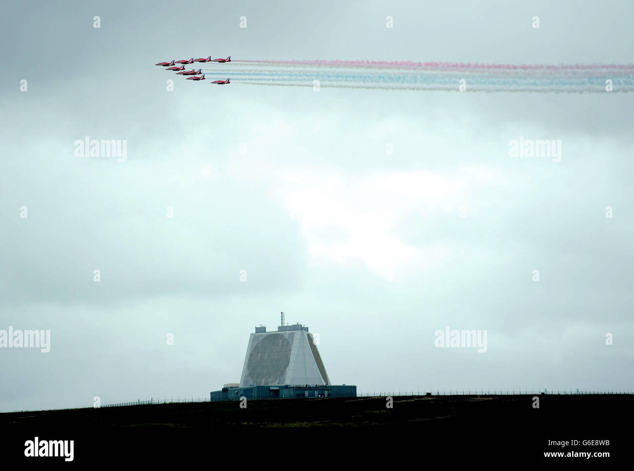 The RAF Red Arrows display team fly over RAF Fylingdales as they help ...