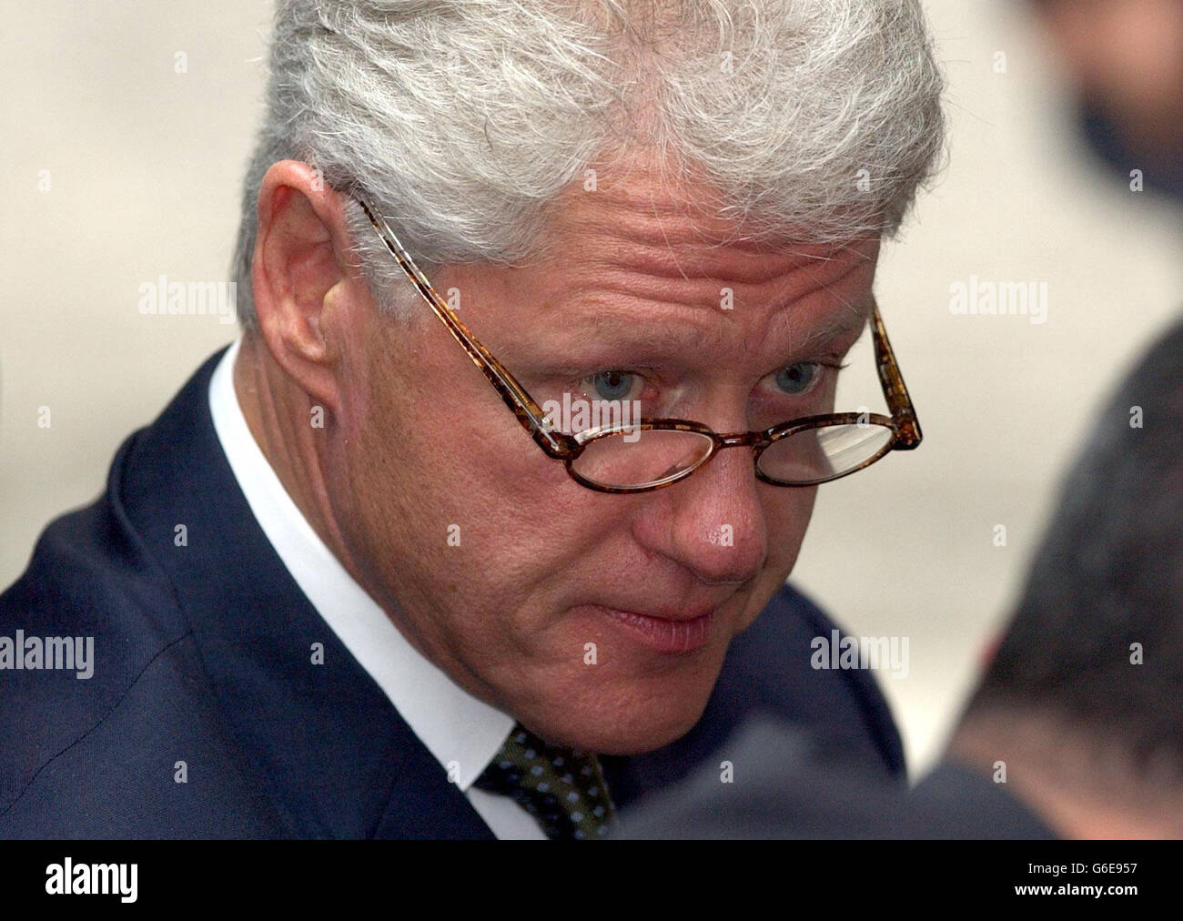 Former US President Bill Clinton speaks to his advisors before meeting ...