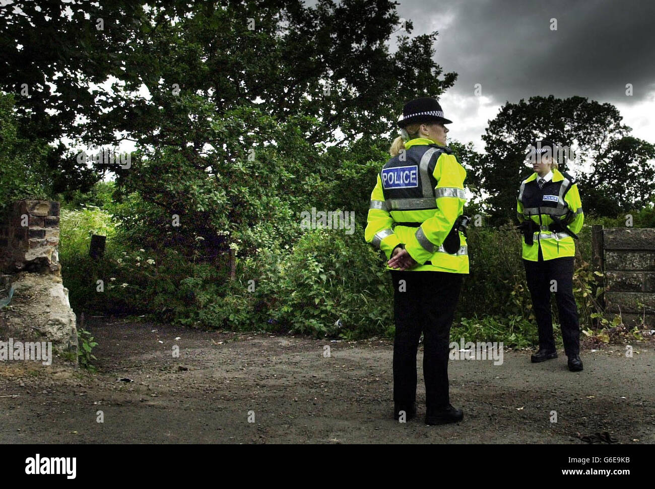 Police officers stand by during a reconstruction of the final known ...