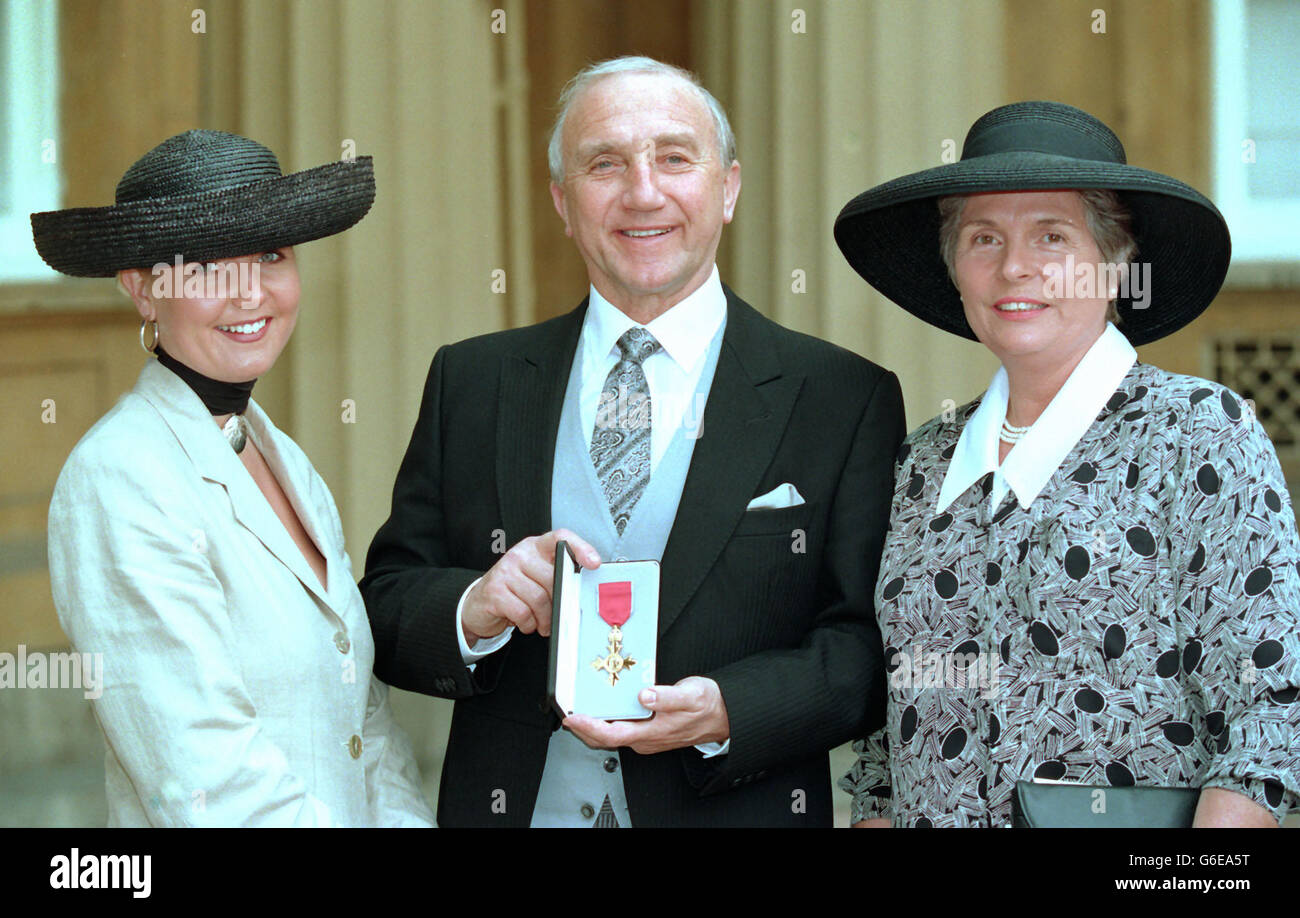 Micky Stewart, with his OBE at Buckingham Palace with his family Stock ...