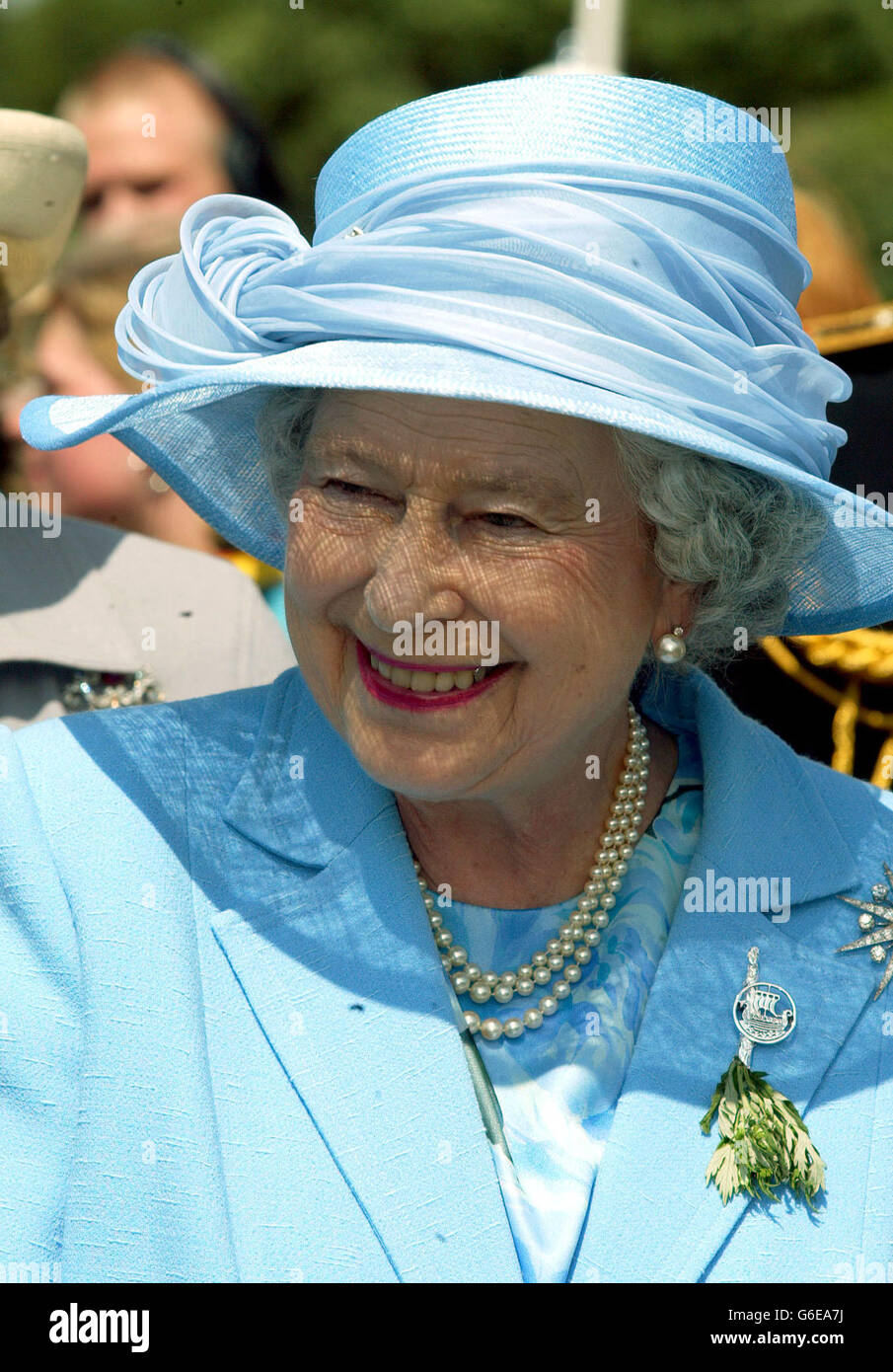 Royal blue suit head shoulders smiling queen elizabeth ii hi-res stock ...