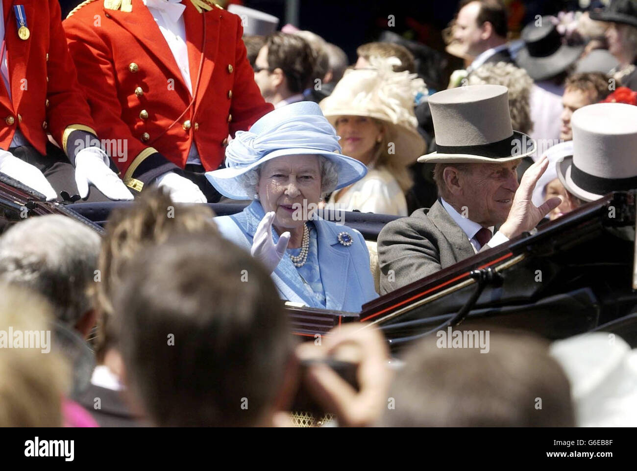 Queen Elizabeth II waves to wellwishers as she arrives with Prince ...
