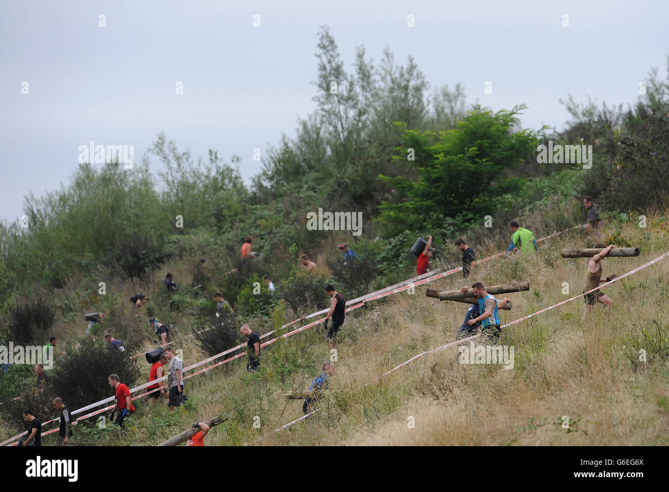 Participants tackle the log carry during the Spartan Super Race at West ...