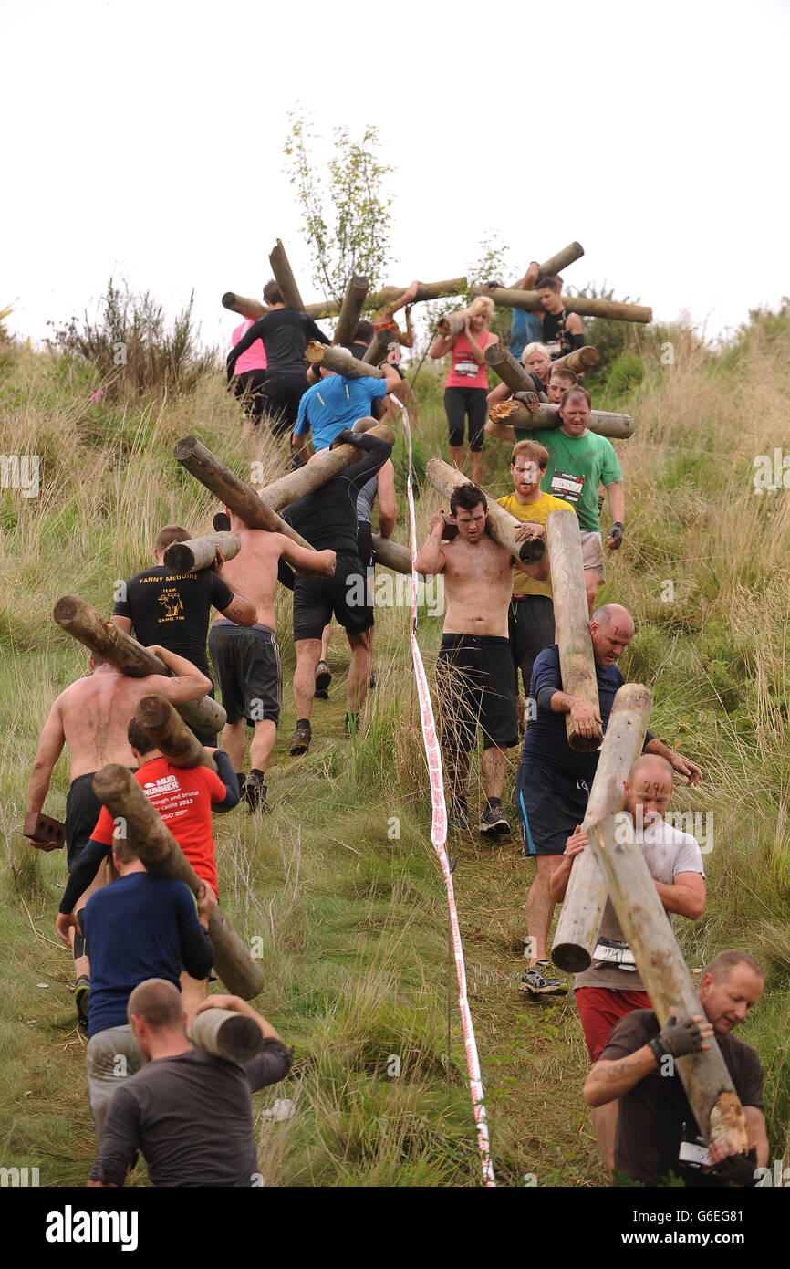 Participants tackle the log carry during the Spartan Super Race at West ...