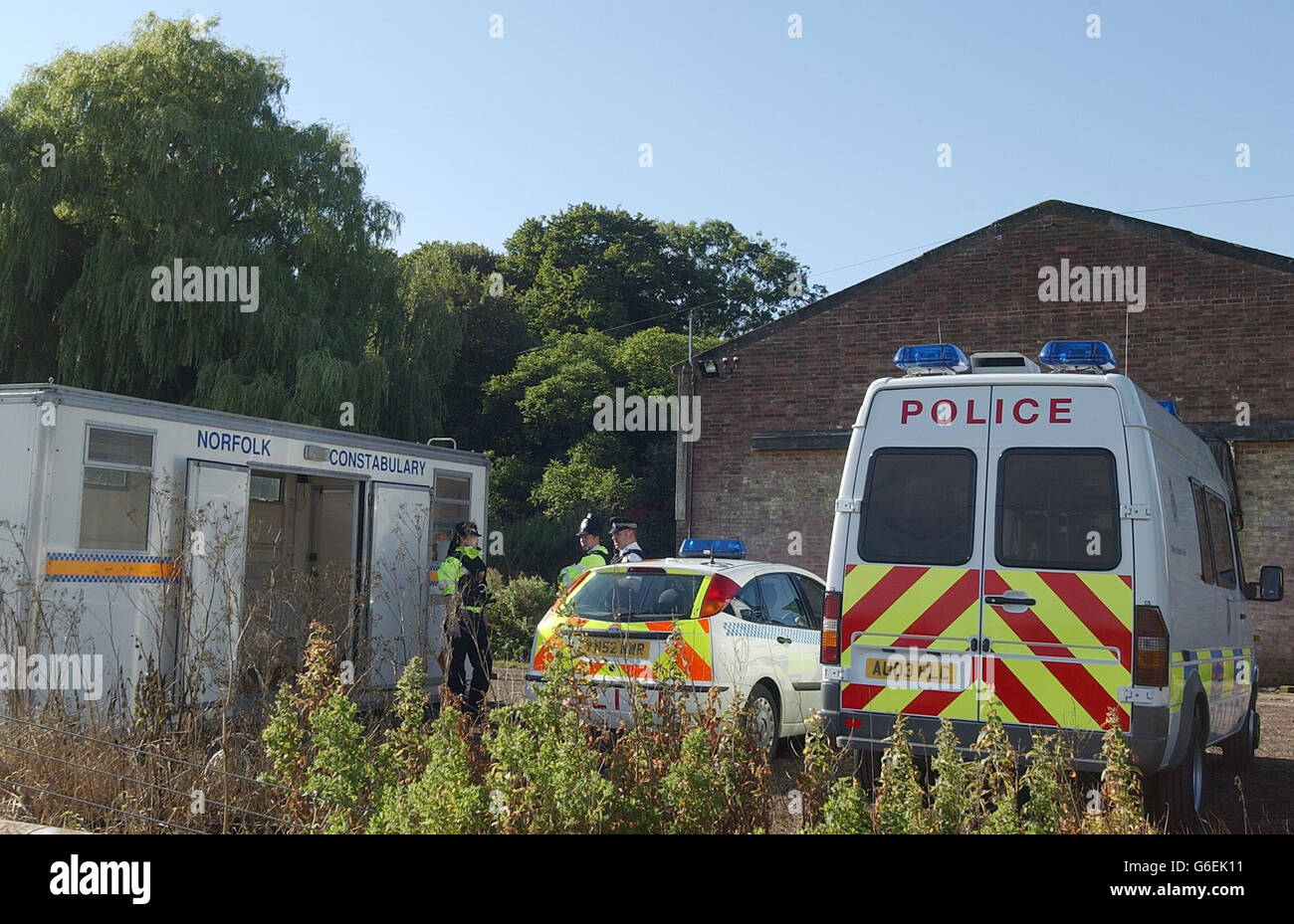 Police stand by the portable police station in the grounds of Tony ...