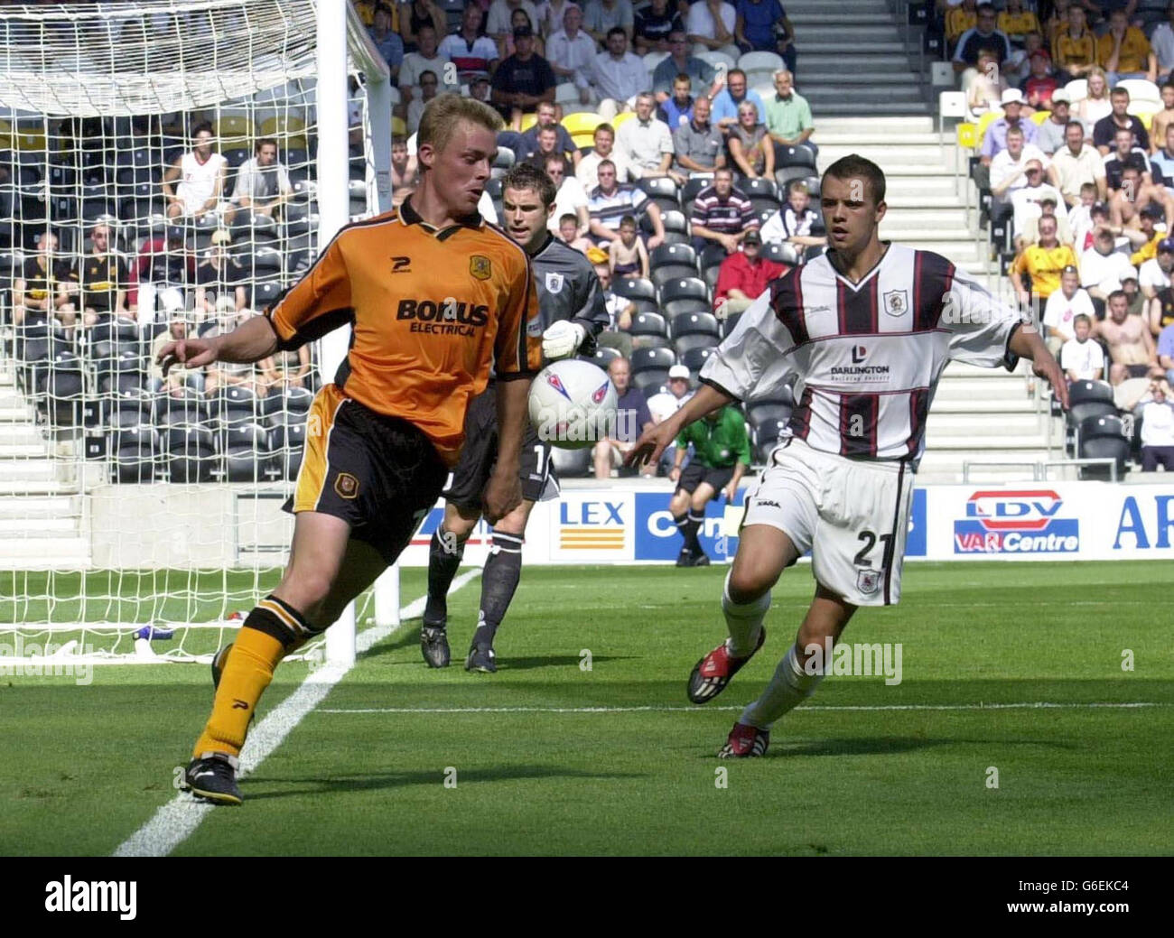 Hull's Danny Allsopp (L) clears while under pressure from Joey ...