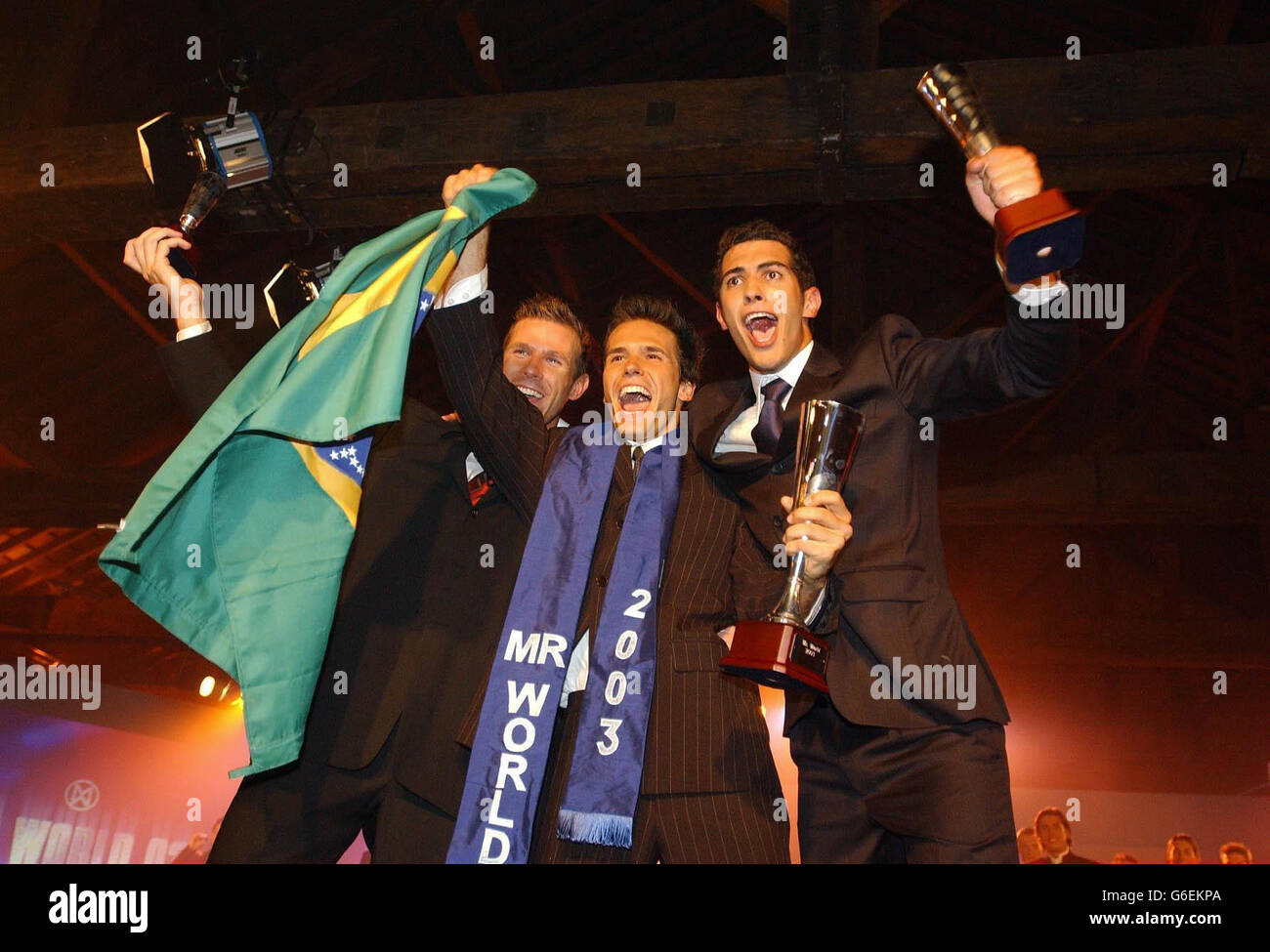 Mr World 2003 Gustavo Cabral Narciso of Brazil (centre) flanked by ...